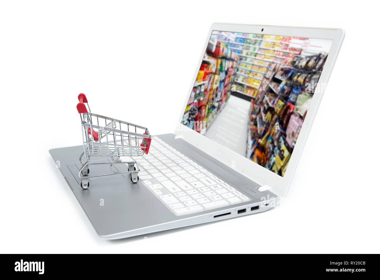 Internet online shopping concept with computer and cart Stock Photo - Alamy