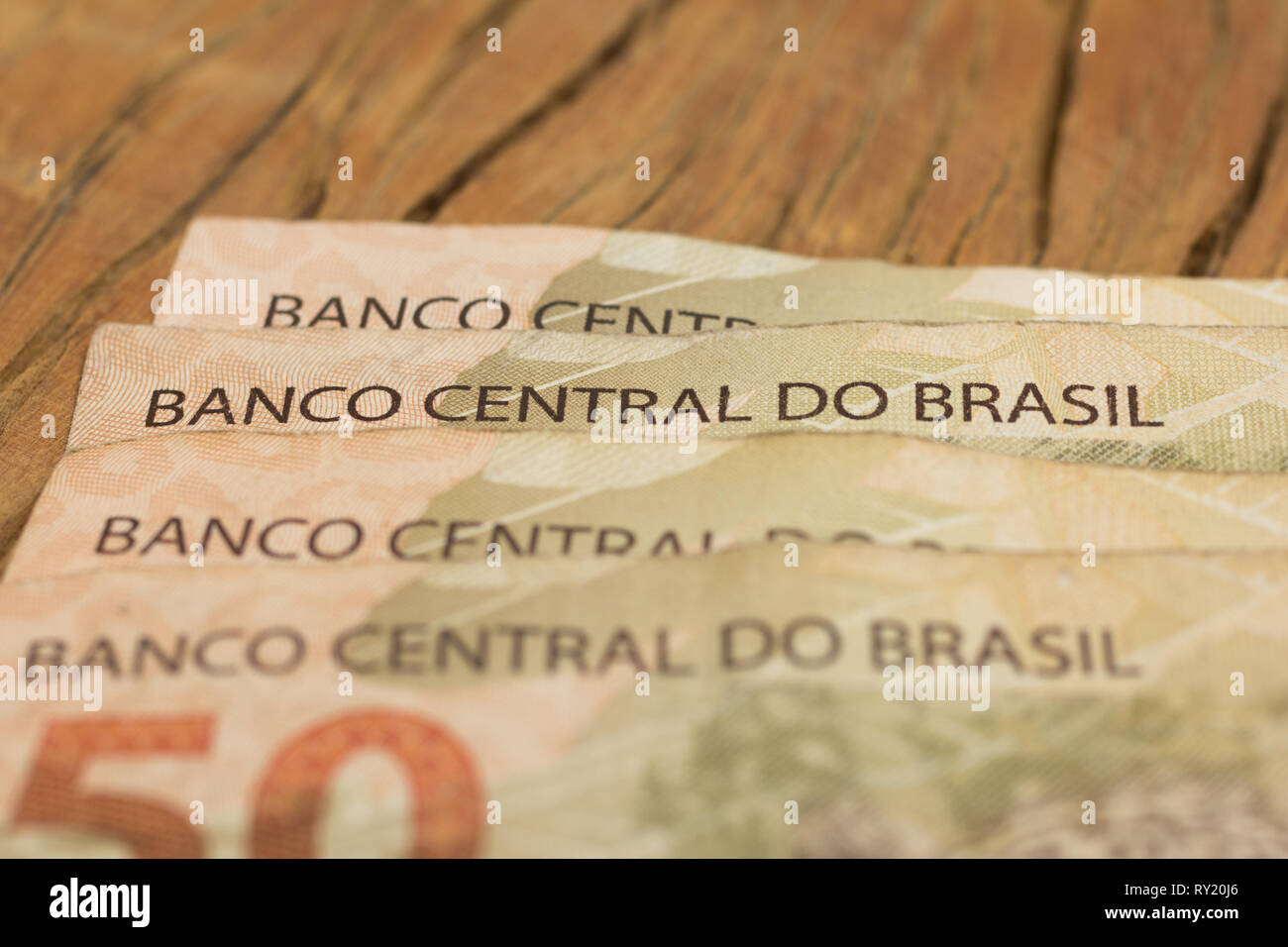 Cash bills from brazilian currency. Close up of cash bills on rustic ...
