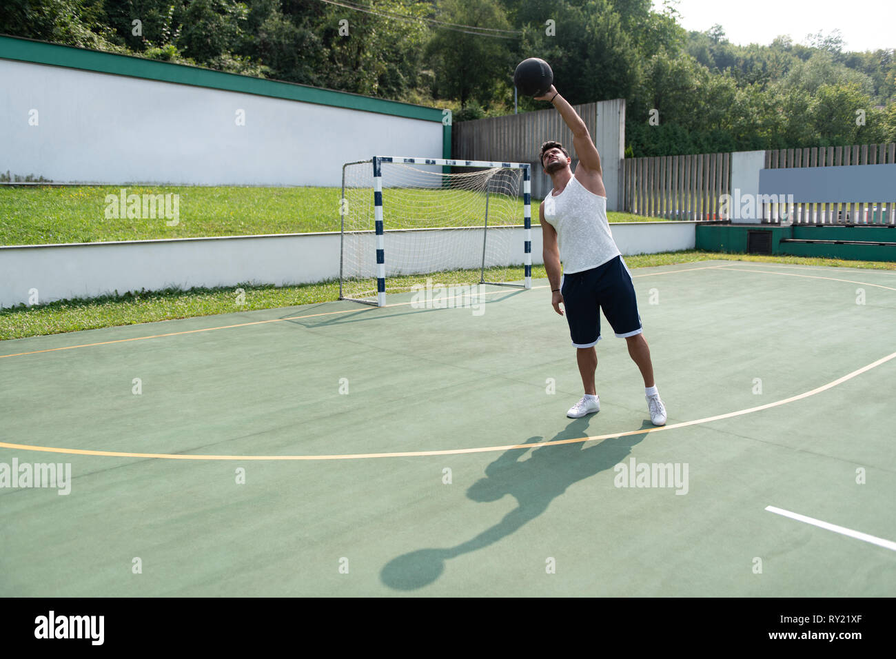 Basketball Player Bodybuilder Practicing And Posing For Basketball And ...