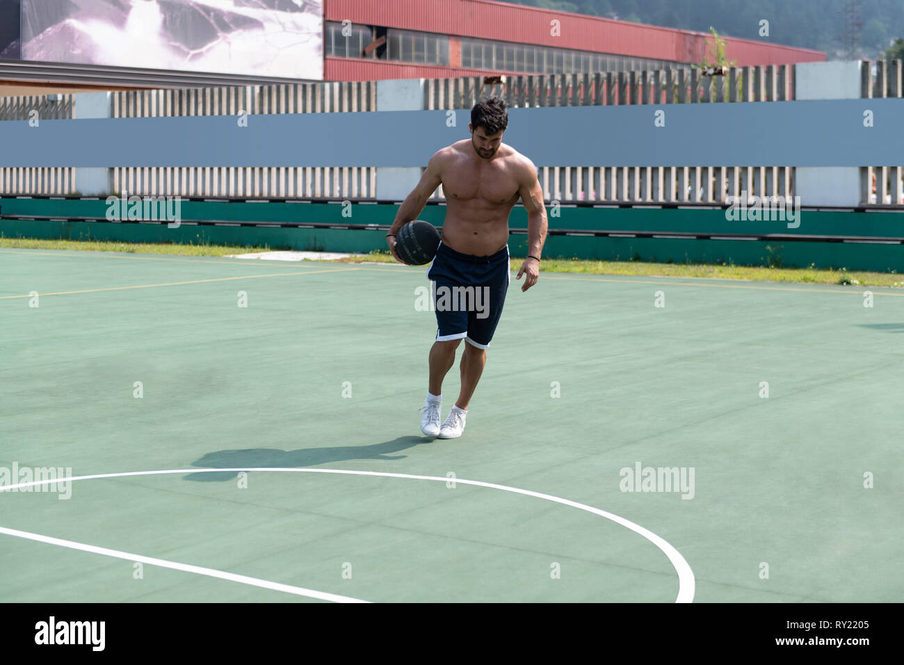 Basketball Player Bodybuilder Practicing And Posing For Basketball And ...