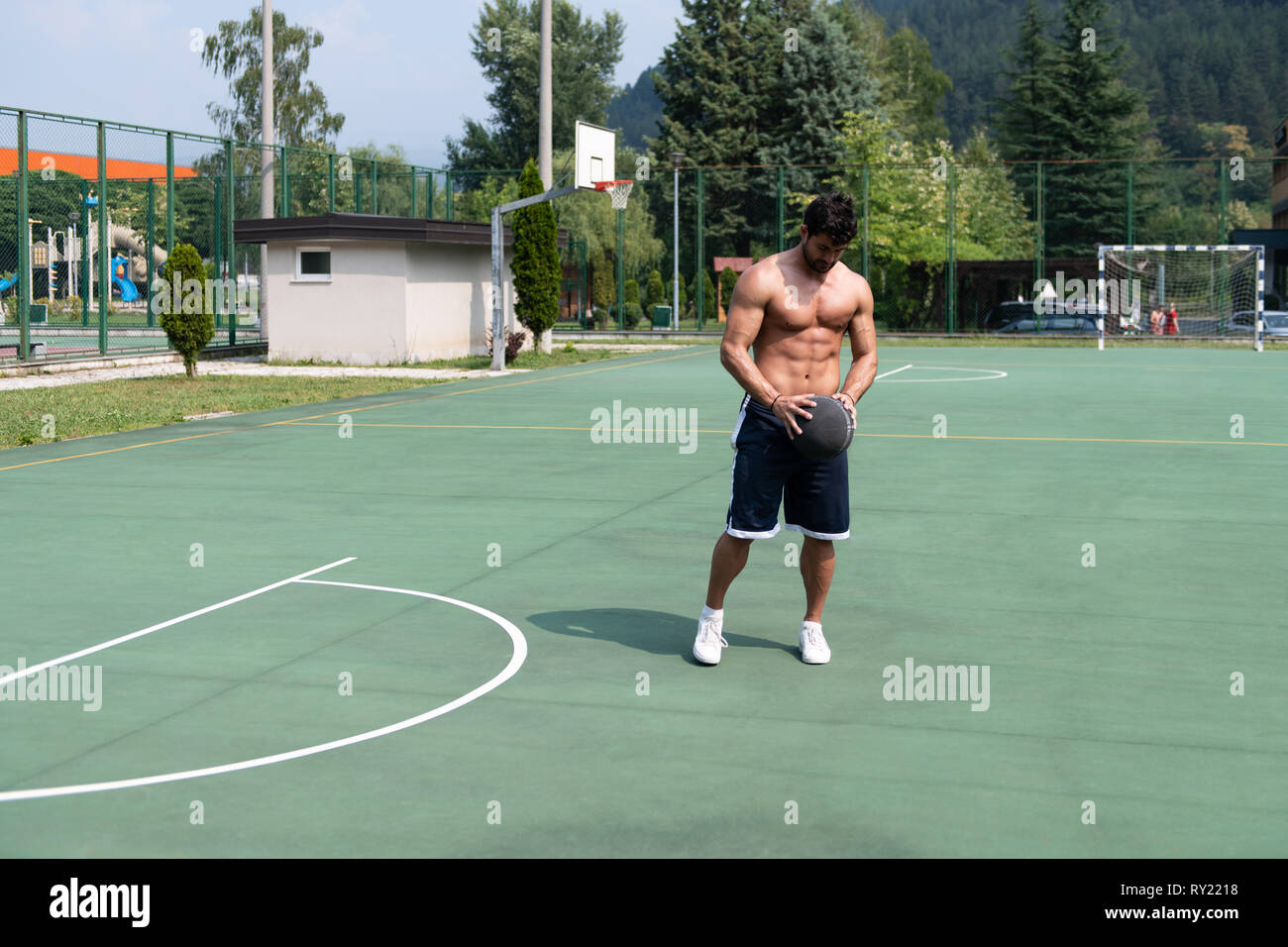 Basketball Player Bodybuilder Practicing And Posing For Basketball And ...