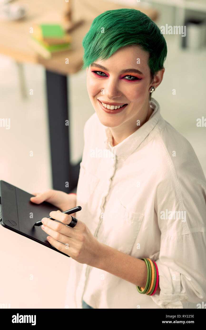 Joyful happy woman drawing a beautiful picture Stock Photo - Alamy Joyful happy woman drawing a beautiful picture Stock Photo - Alamy