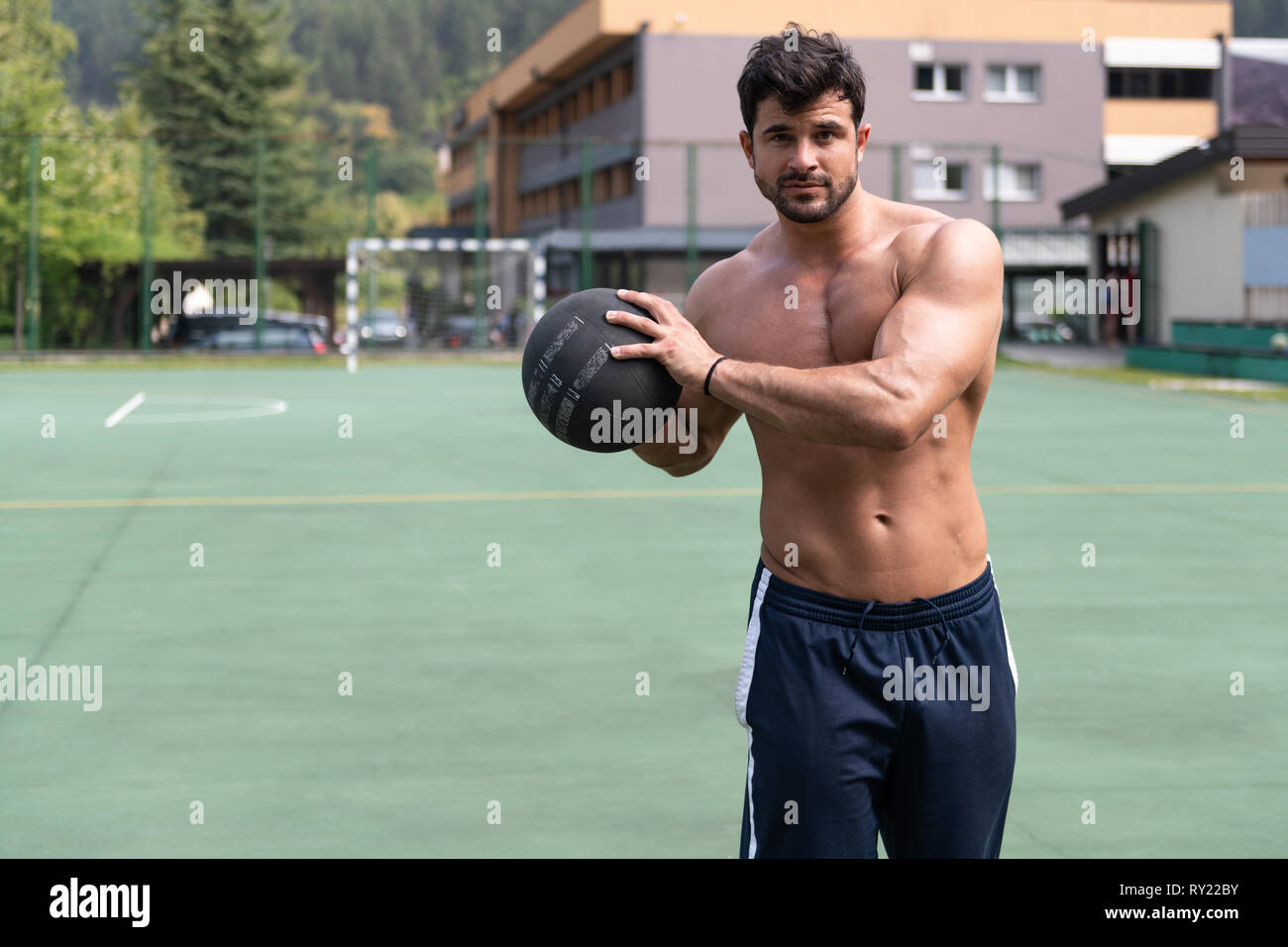 Basketball Player Bodybuilder Practicing And Posing For Basketball And ...