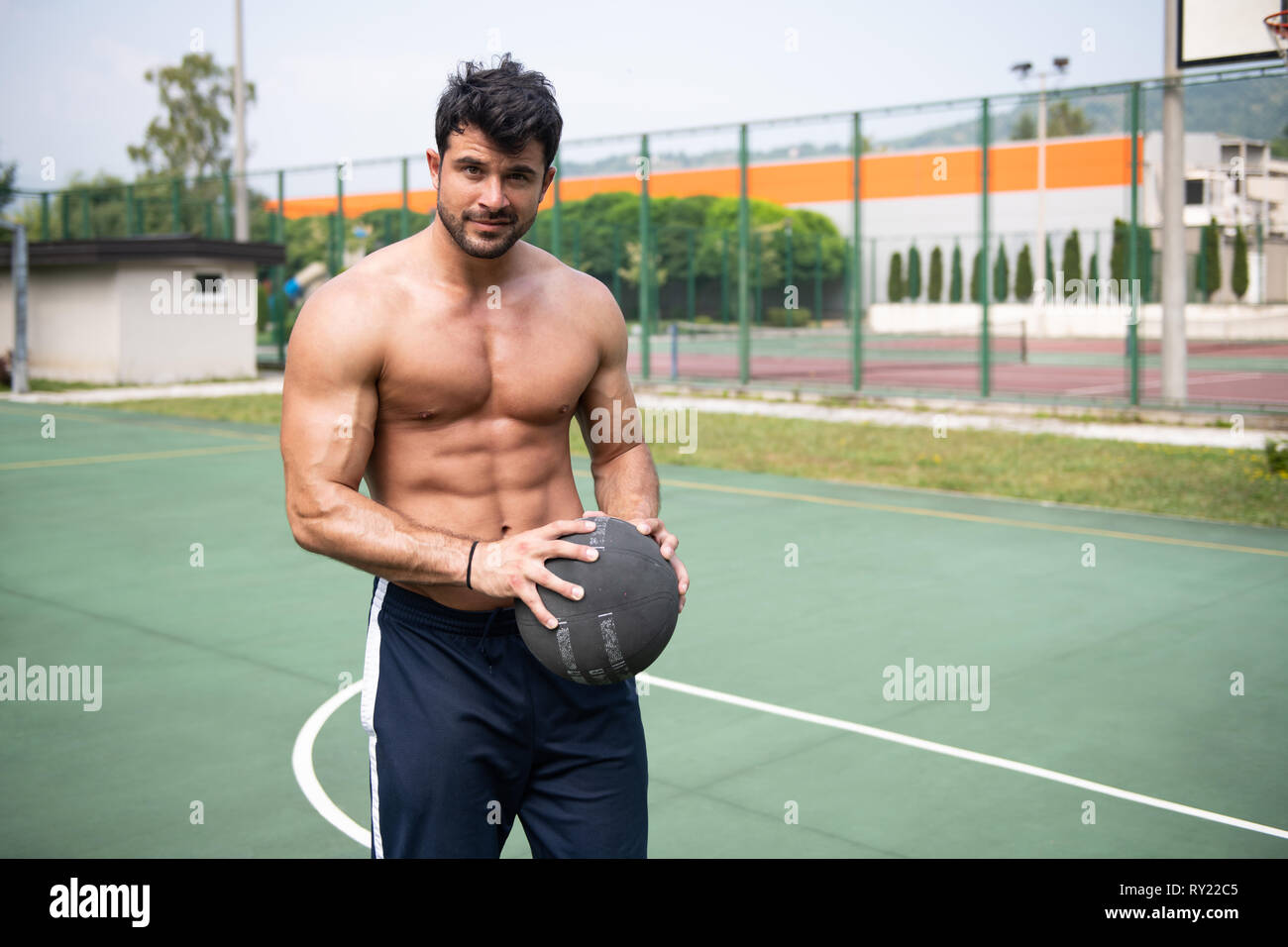 Basketball Player Bodybuilder Practicing And Posing For Basketball And ...