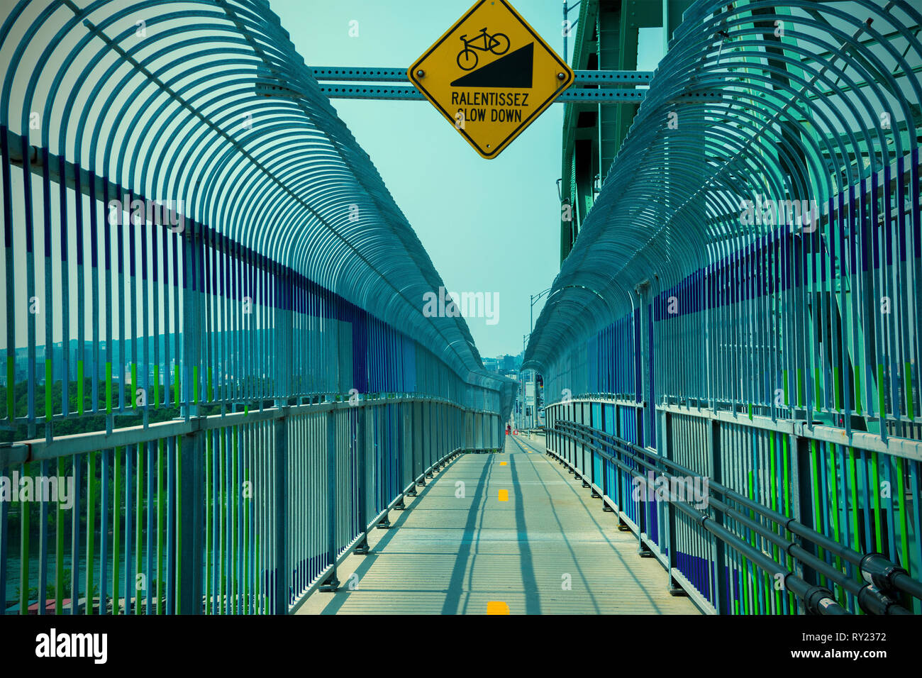 Bicycle path on Jack Carter bridge with a slow down sign Stock Photo ...