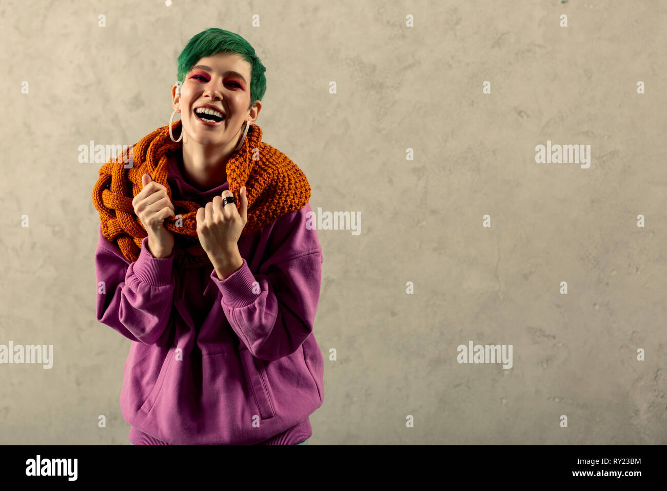 Delighted cheerful young woman feeling very happy Stock Photo - Alamy