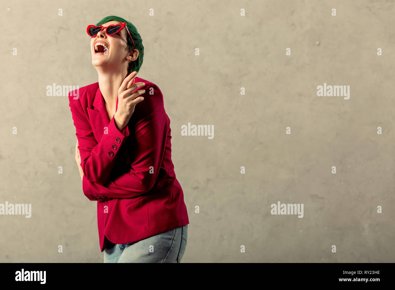 Delighted nice young woman feeling very positive Stock Photo - Alamy