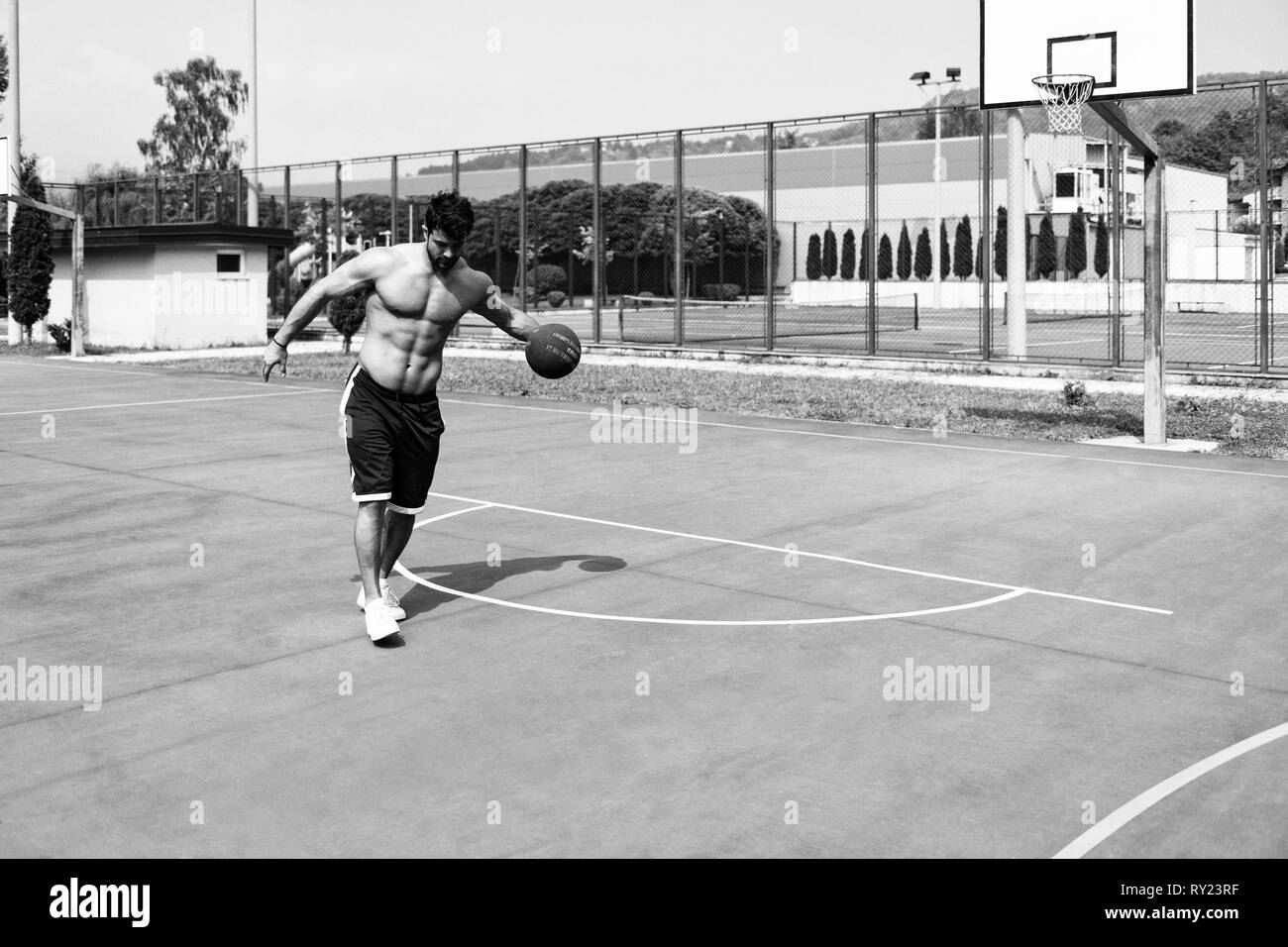 Basketball Player Bodybuilder Practicing And Posing For Basketball And ...