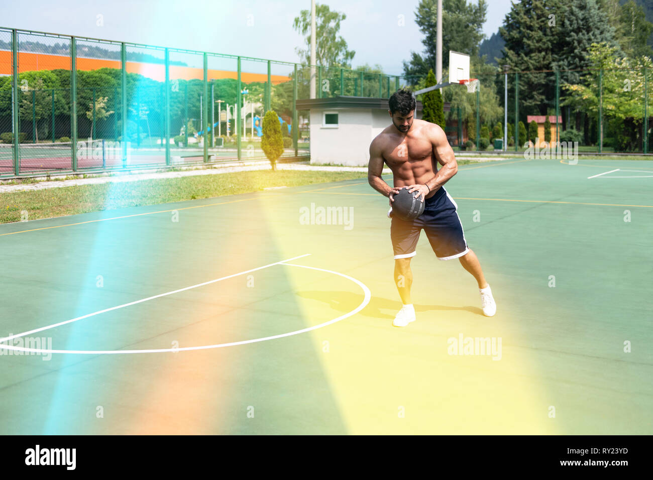 Basketball Player Bodybuilder Practicing And Posing For Basketball And ...