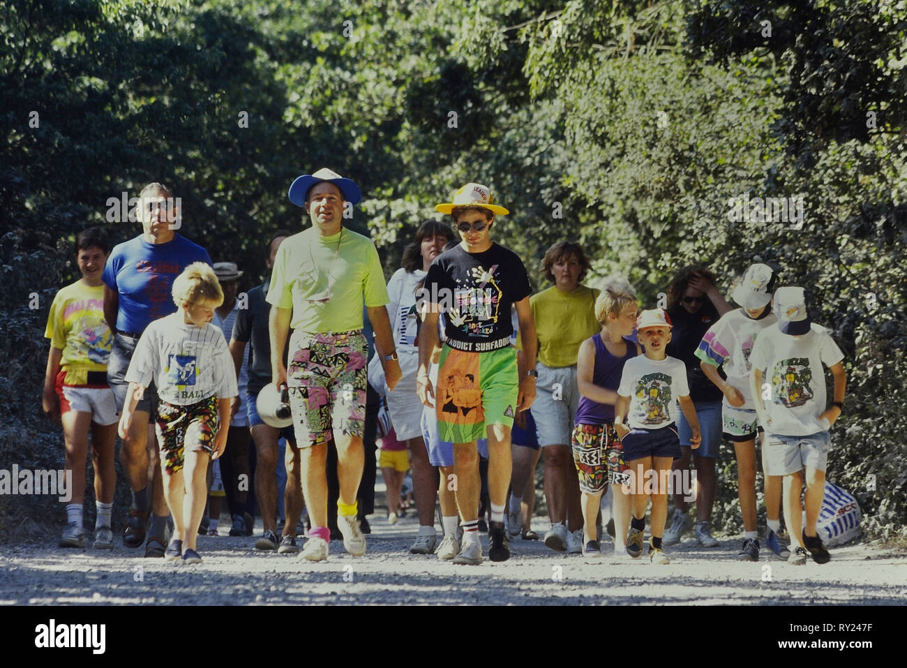 Two Blue Coats (not in uniform) leading campers on a nature trail ...