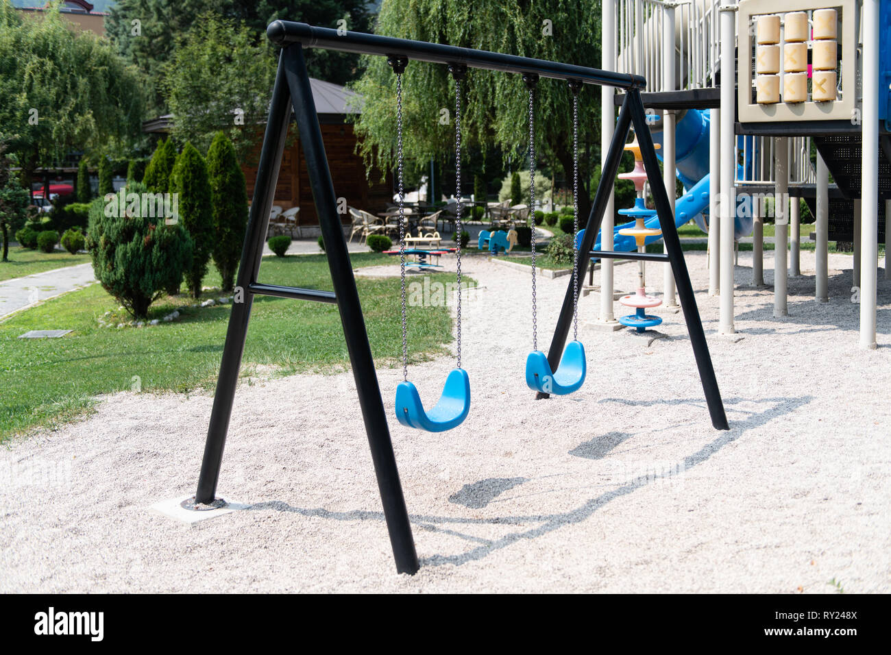Empty Chain Swings in Children Playground Stock Photo - Alamy