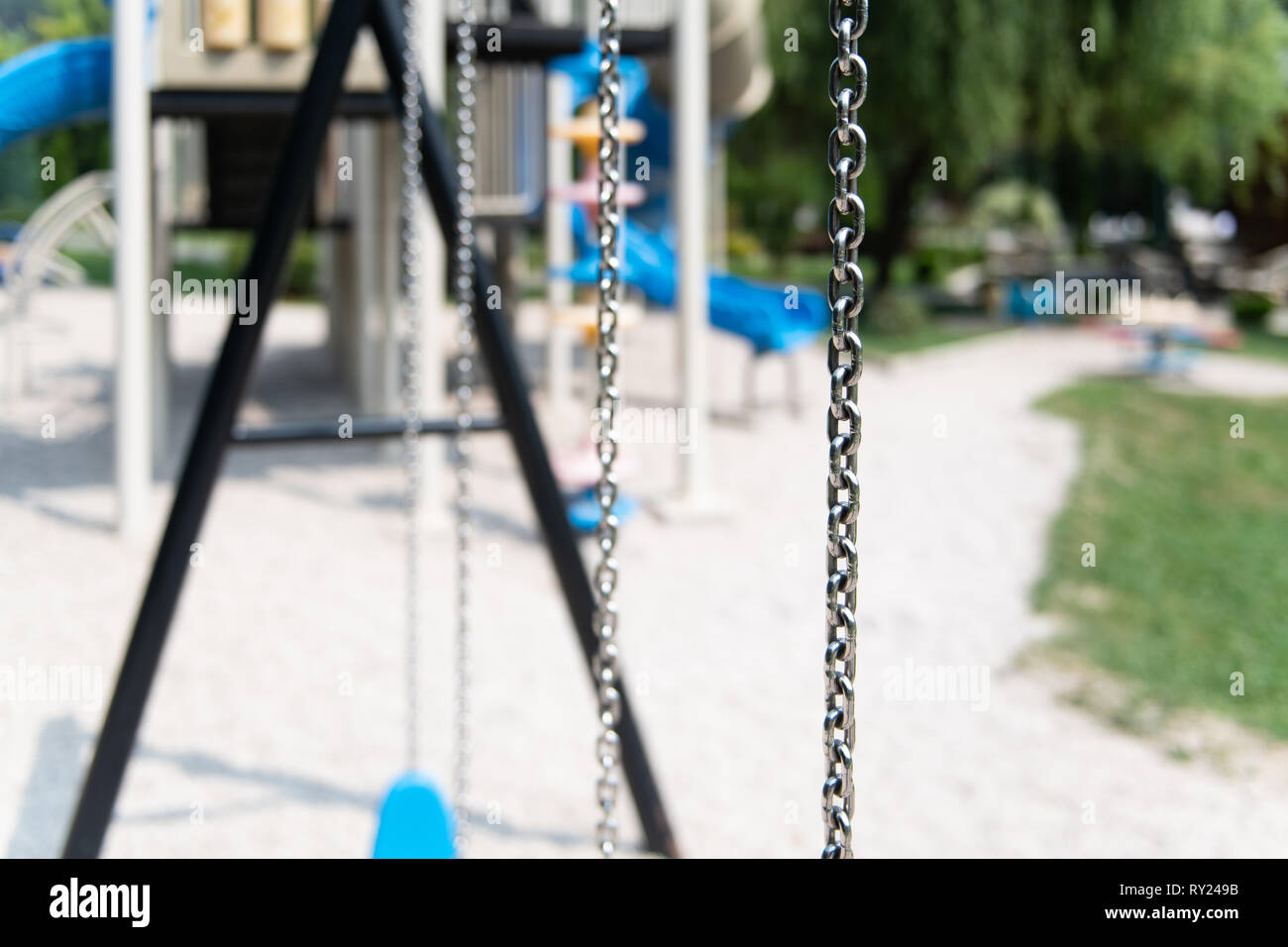 Empty Chain Swings in Children Playground Stock Photo - Alamy