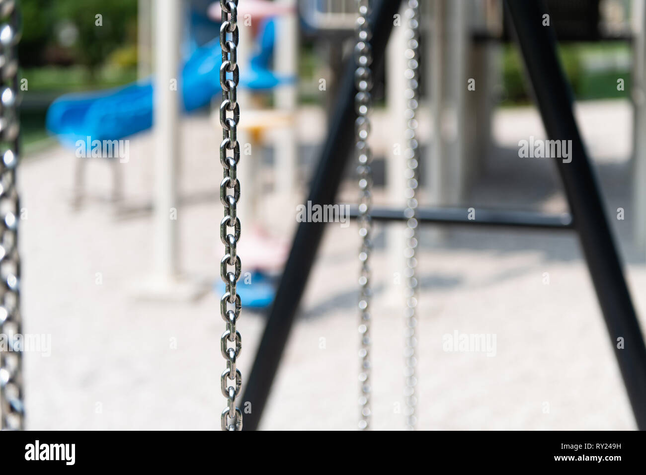 Empty Chain Swings in Children Playground Stock Photo - Alamy