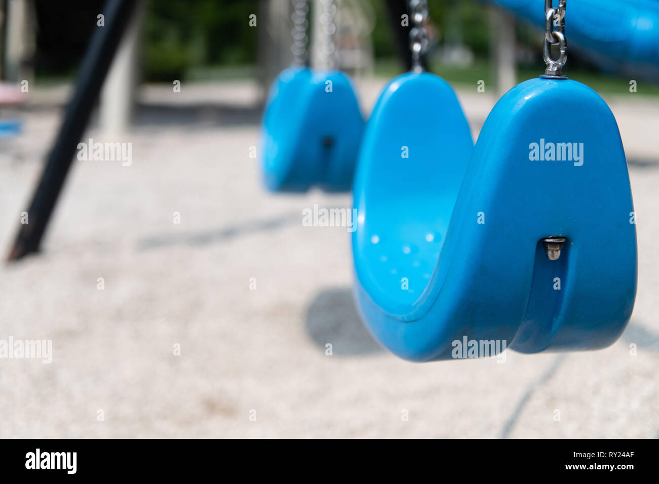 Empty Chain Swings in Children Playground Stock Photo - Alamy