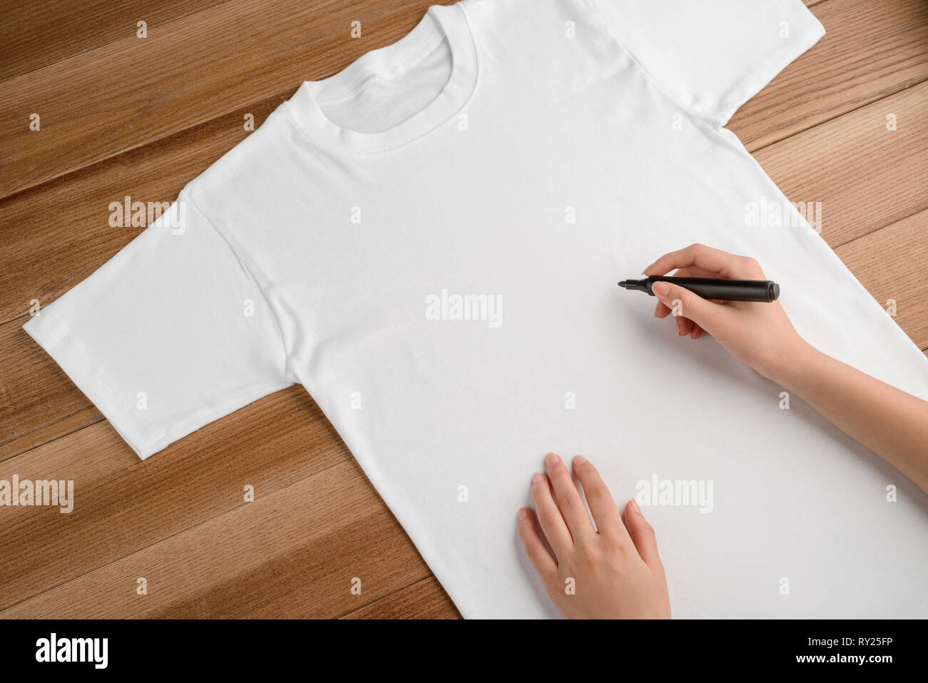 Woman about to draw something Stock Photo - Alamy
