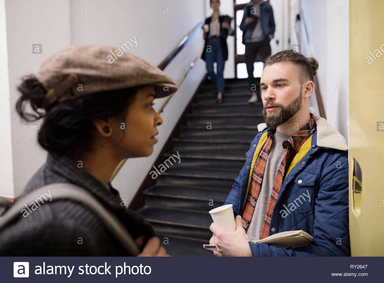 Two students talking men hi-res stock photography and images - Alamy