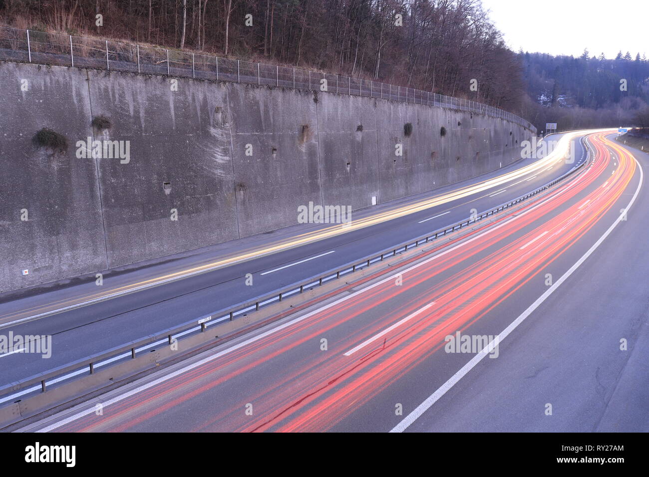 Car light trails on highway during twilight Stock Photo - Alamy