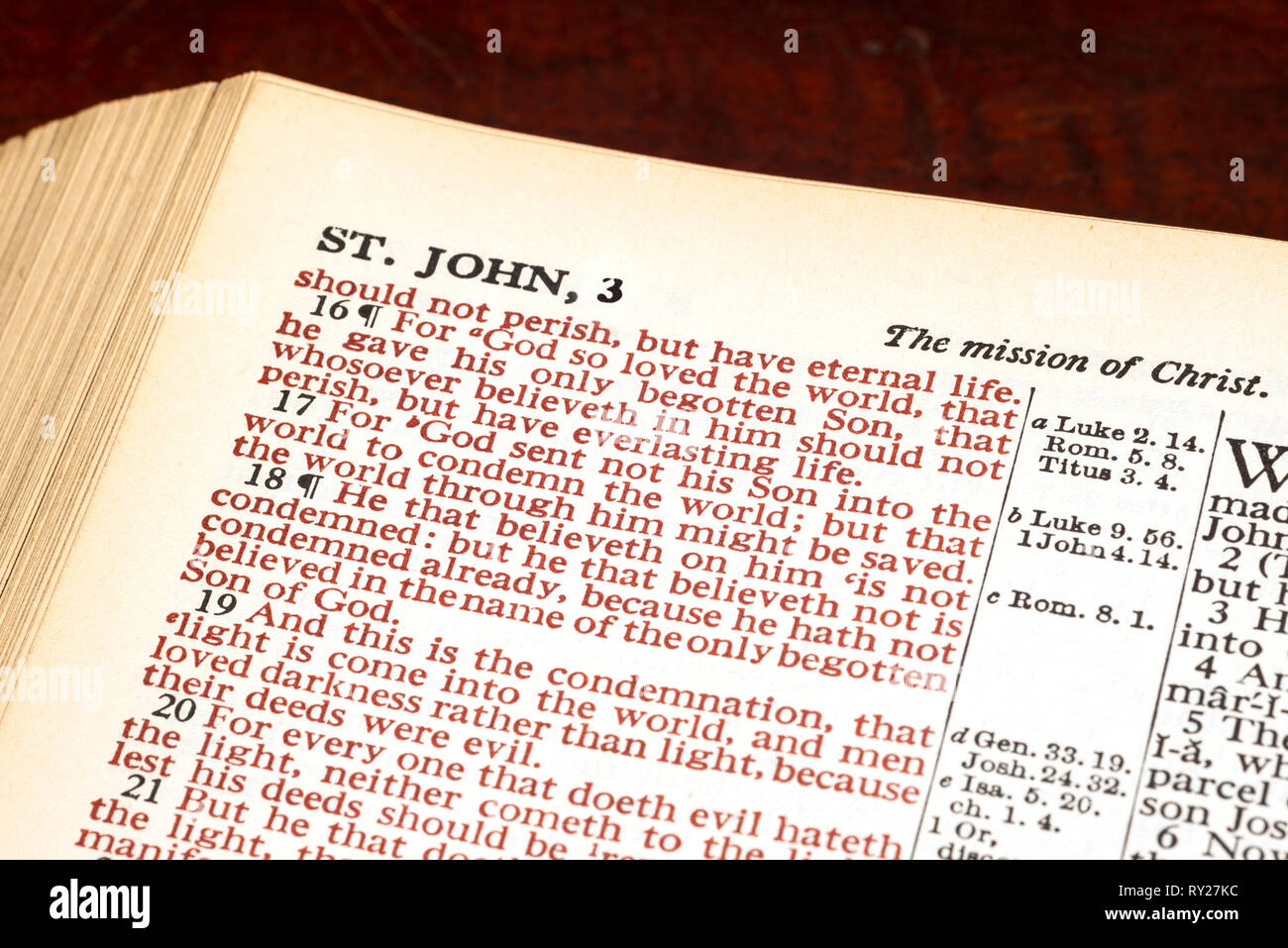 Horizontal close-up shot of an open Bible showing John 3:16 in red ...