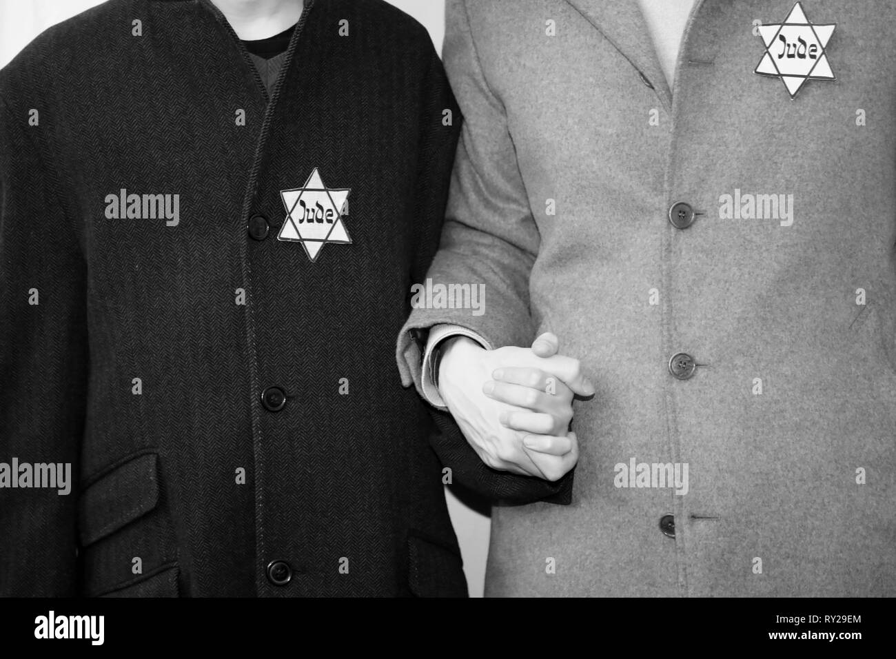 Jewish father and young son with winter coats and the symbol of the ...