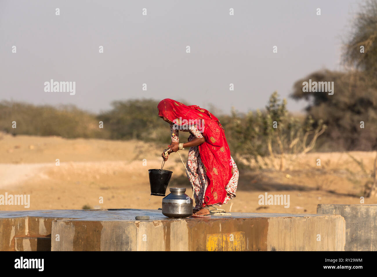 Woman fetching water in the the Thar Desert, Khuri , Rajasthan, India ...
