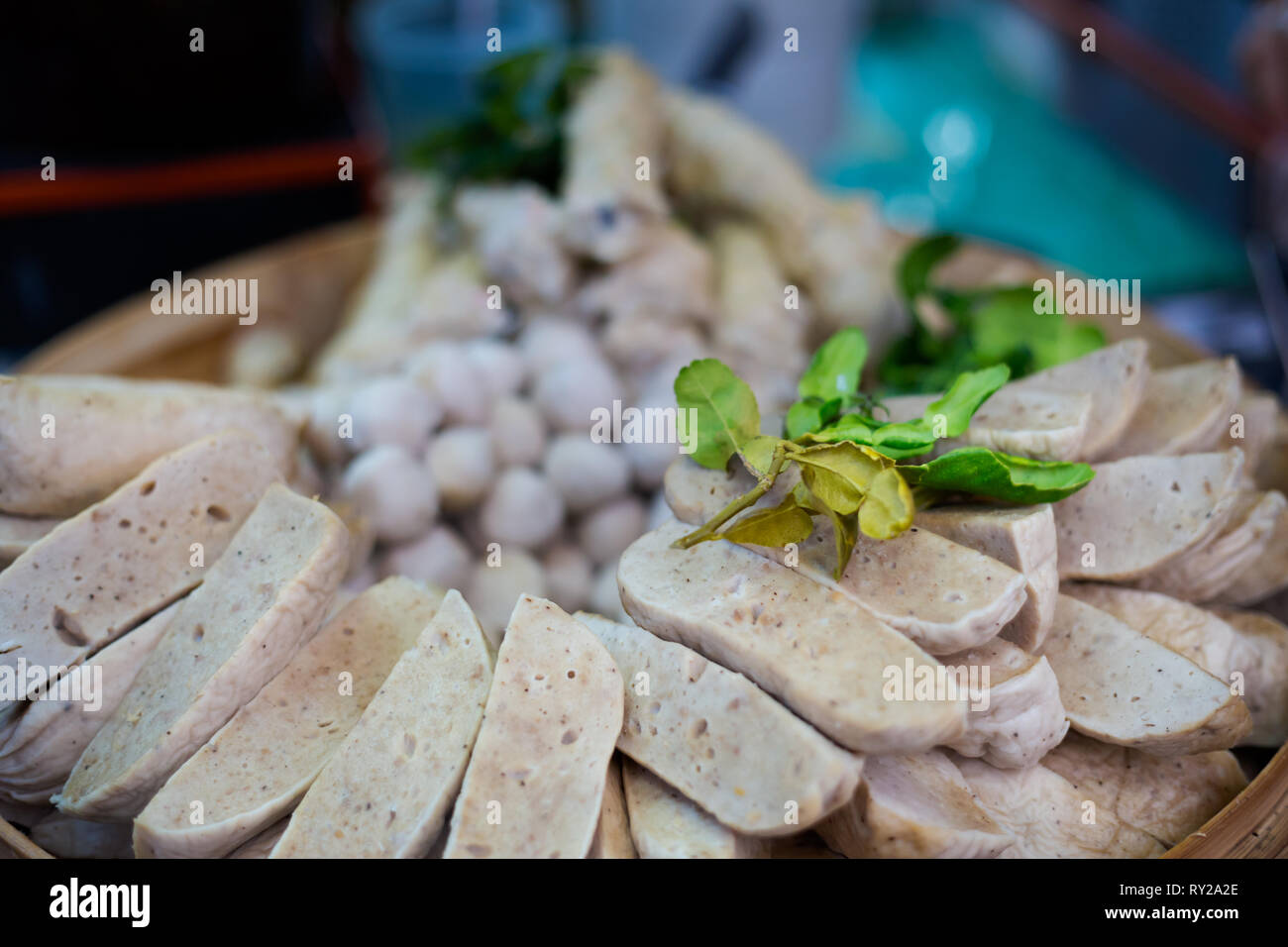 Fresh prepared asian minced white pork sausage Moo Yor on local market ...