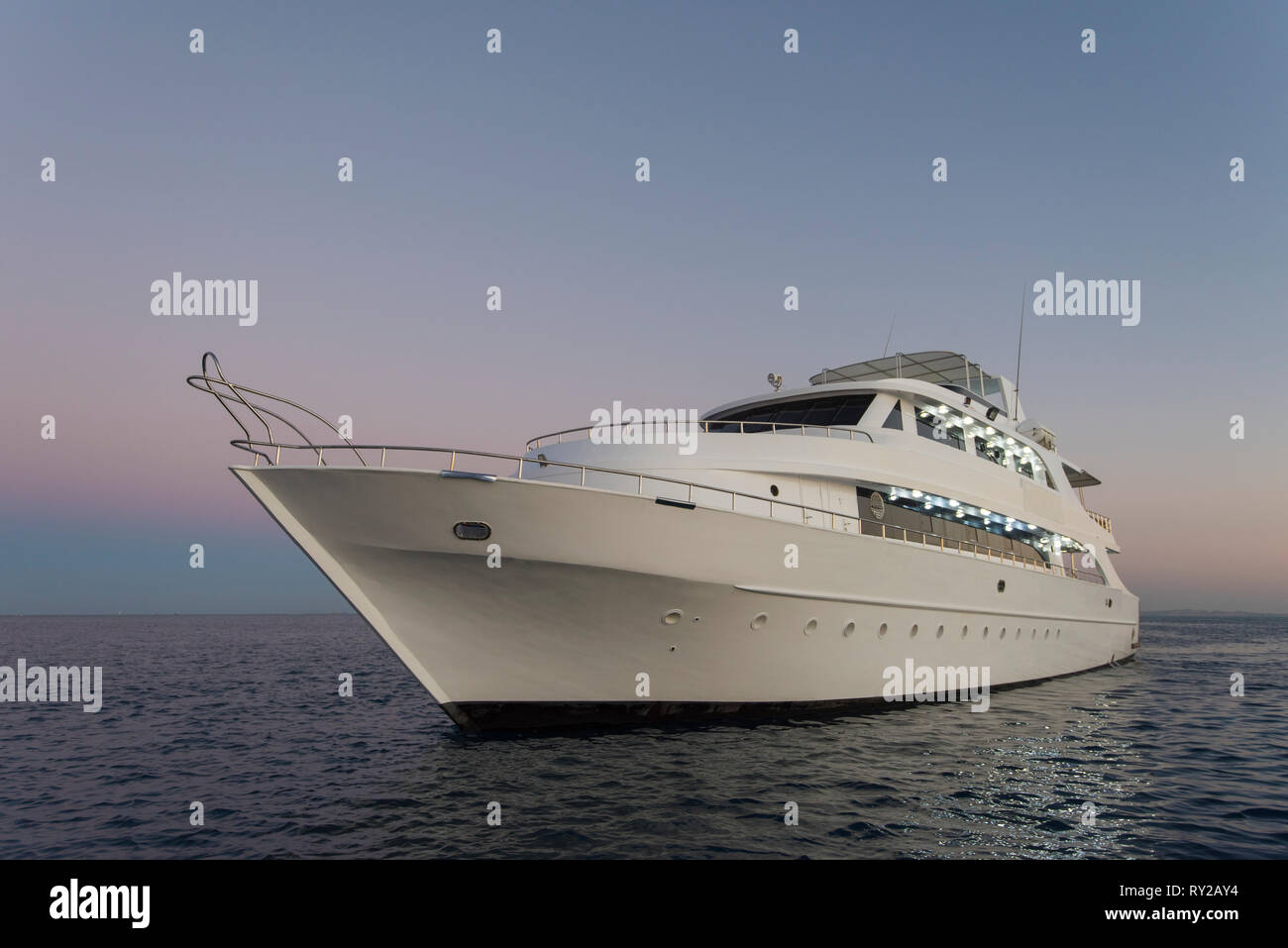 Large luxury motor yacht under way sailing out on tropical sea ocean at ...