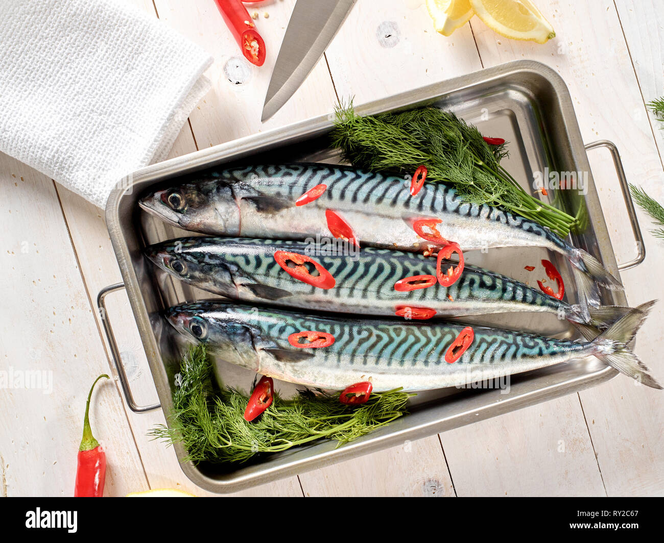 Fresh mackerel being prepared to be roasted Stock Photo - Alamy