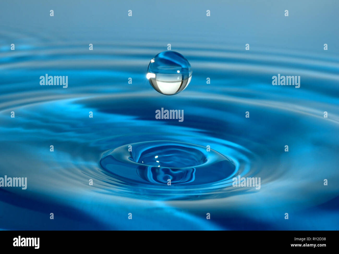 Water splash. Falling drop of rain Stock Photo - Alamy