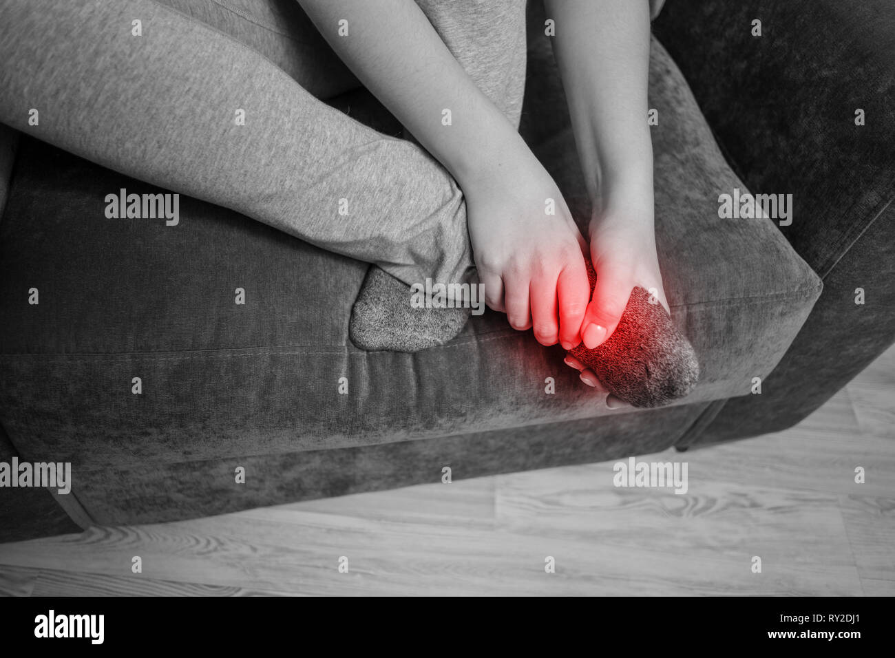 pain in foot, girl holds her feet, foot massage, cramp, muscular spasm ...