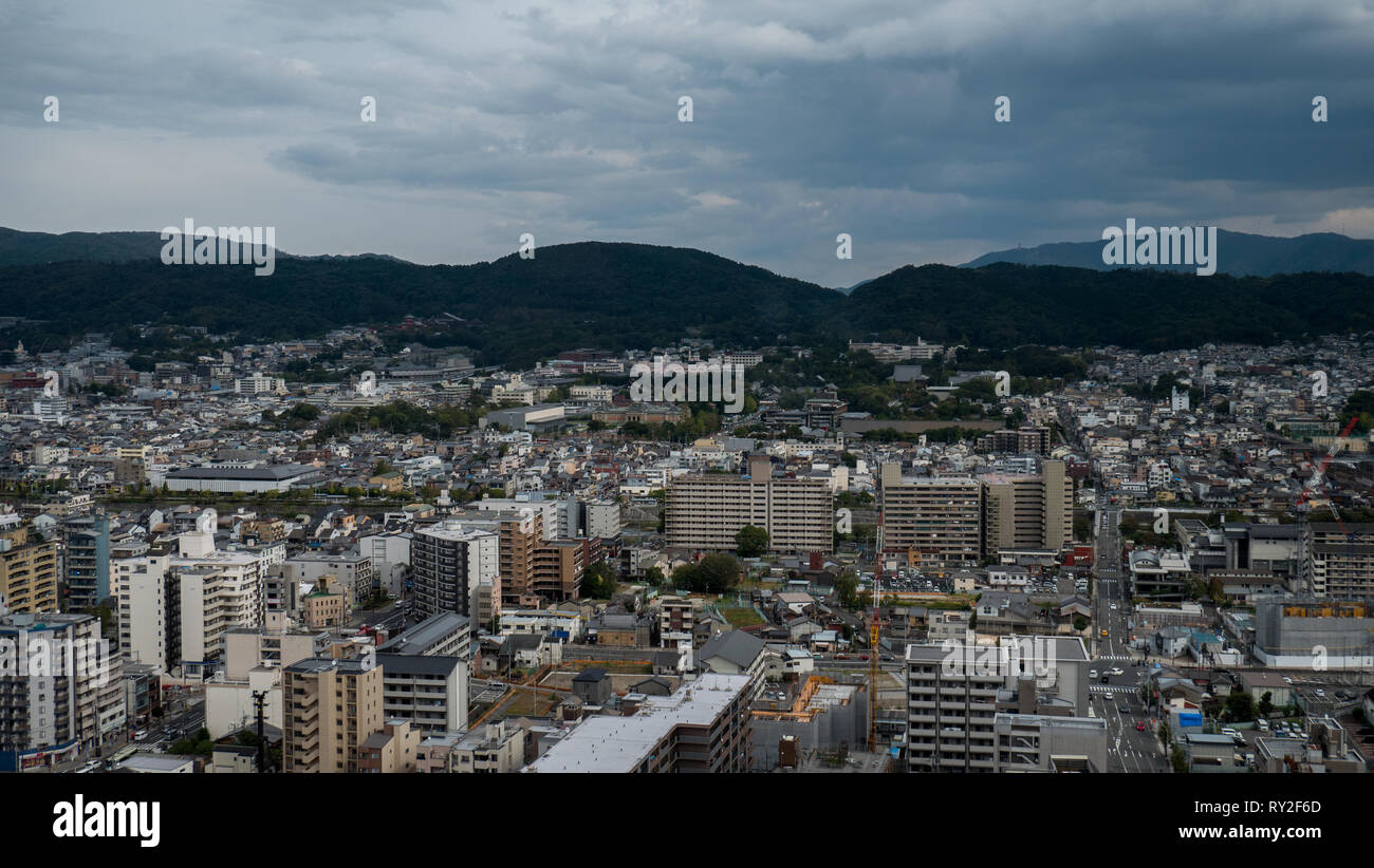 Aerial shots of the city of Kyoto. Skyscrapers and buildings expand out ...
