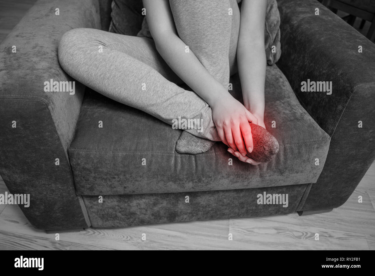 pain in foot, girl holds her feet, foot massage, cramp, muscular spasm ...