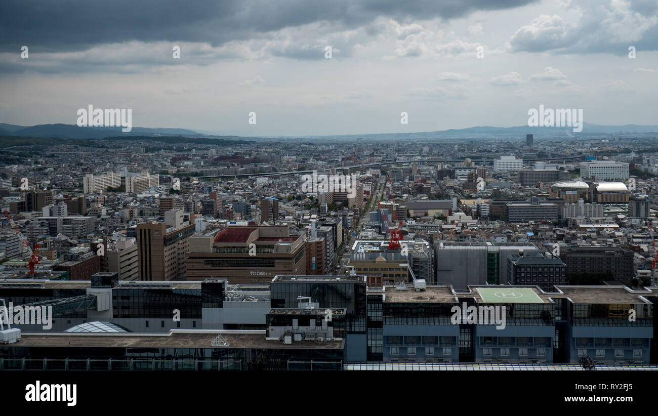 Aerial shots of the city of Kyoto. Skyscrapers and buildings expand out ...