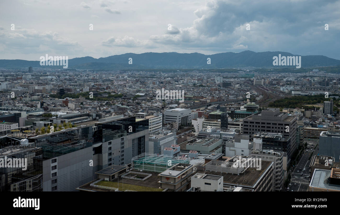 Aerial shots of the city of Kyoto. Skyscrapers and buildings expand out ...