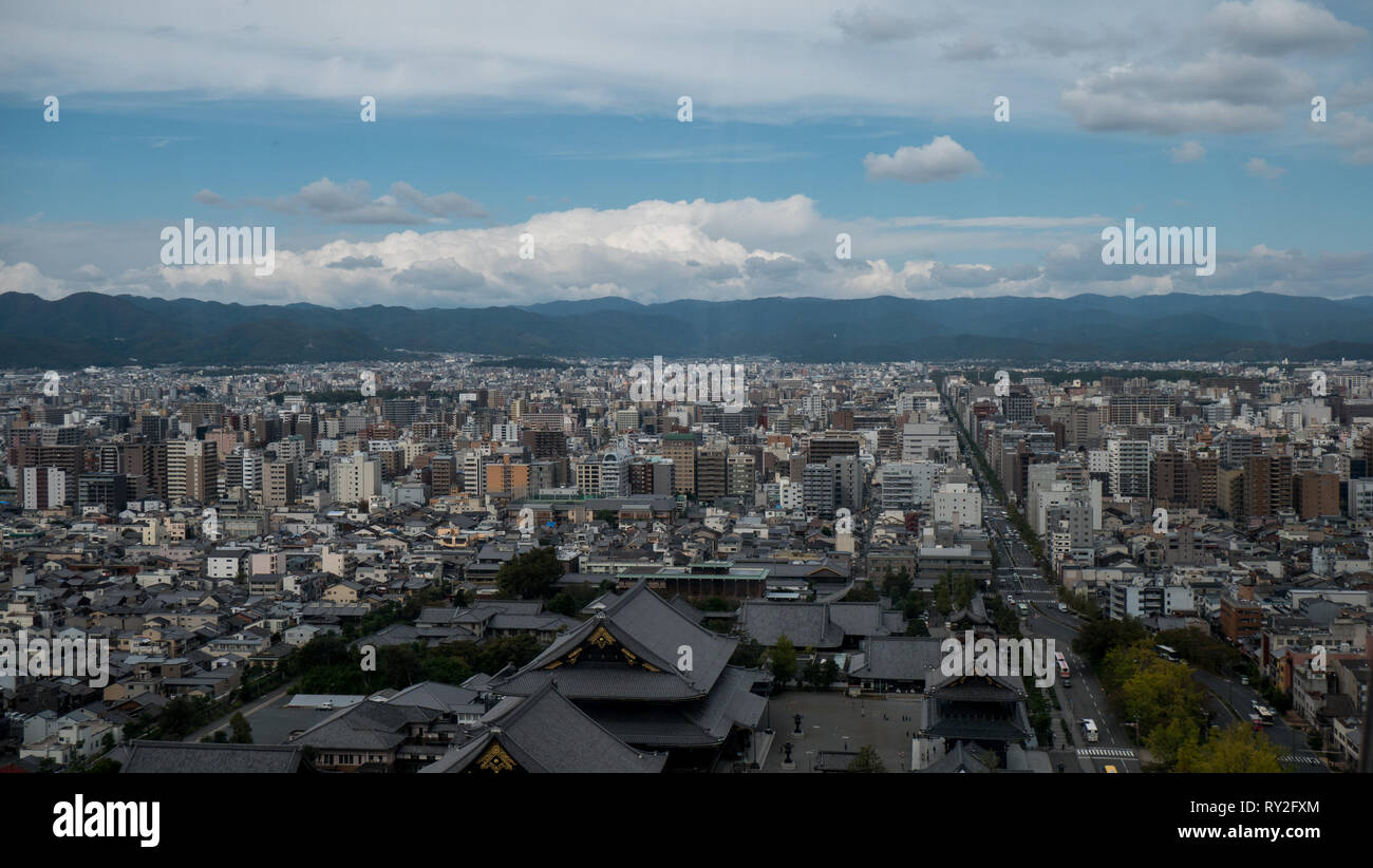 Aerial shots of the city of Kyoto. Skyscrapers and buildings expand out ...
