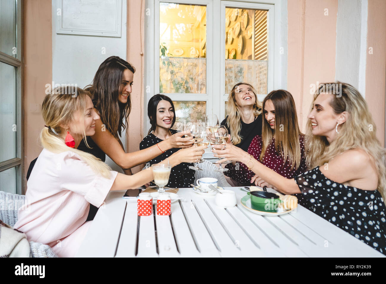 Six girls at the table Stock Photo - Alamy