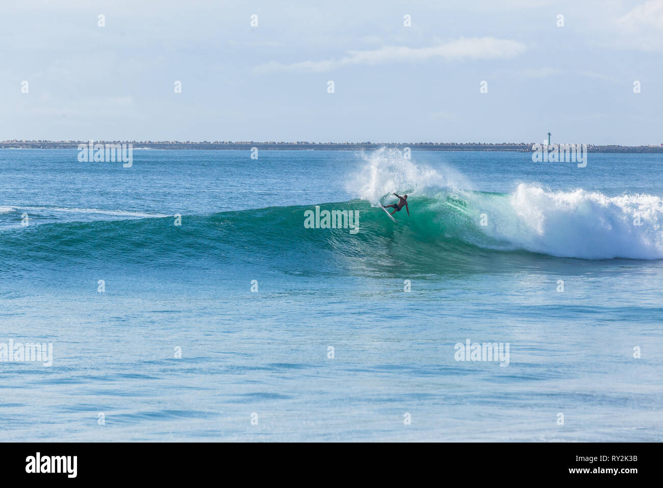 Surfer surfing tube ride turns hollow ocean wave a sporting lifestyle ...