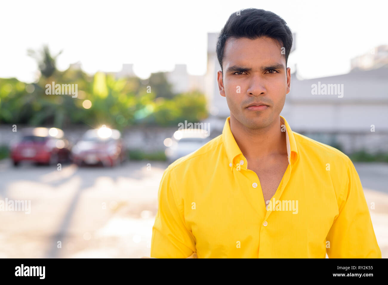 Young handsome Indian man in the streets outdoors Stock Photo - Alamy