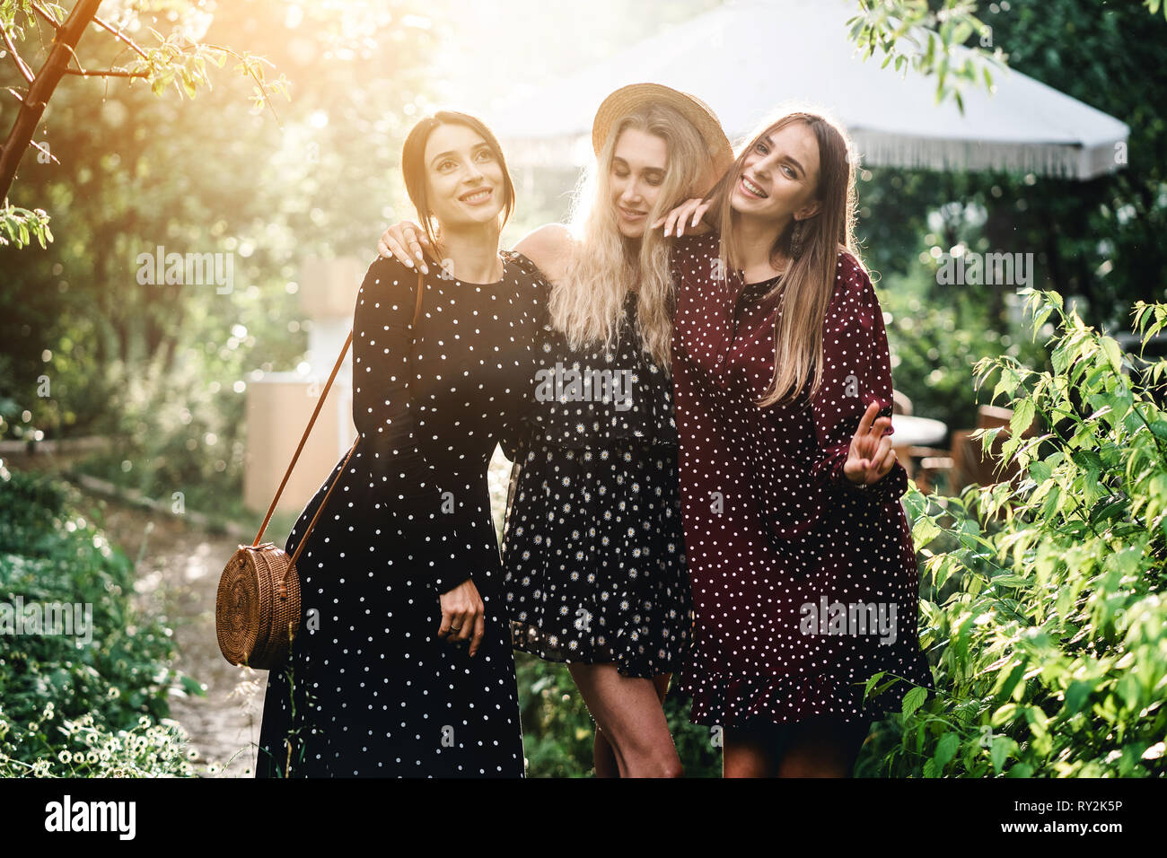 Three girls are photographed on camera Stock Photo - Alamy