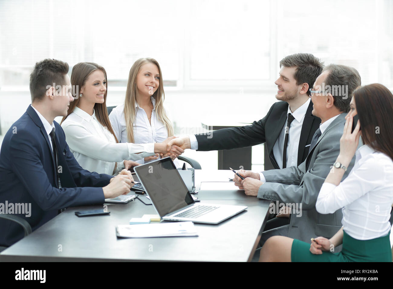 business partners shaking hands after a successful transaction Stock ...