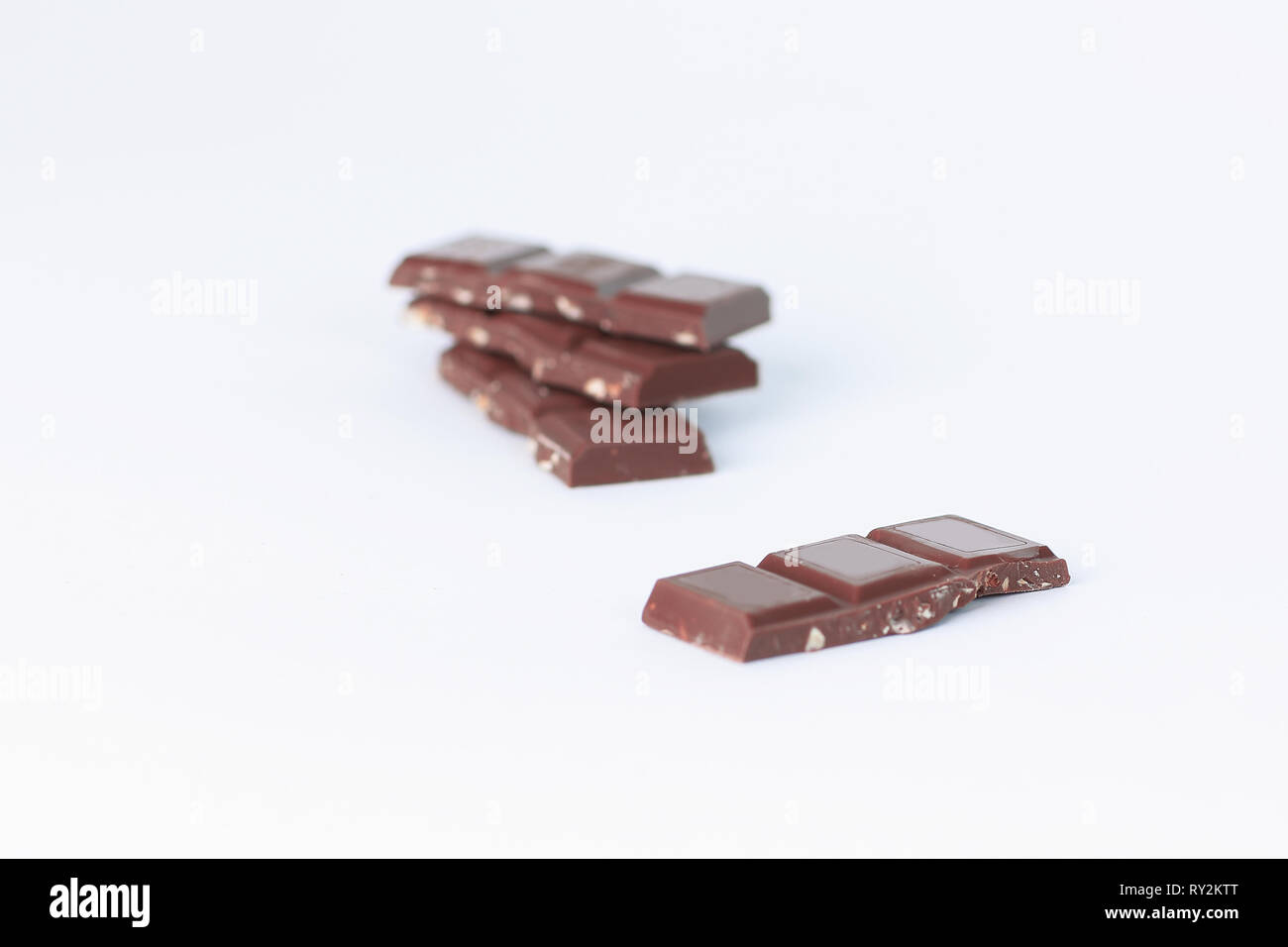 stack pieces of chocolate with nuts isolated on white Stock Photo - Alamy