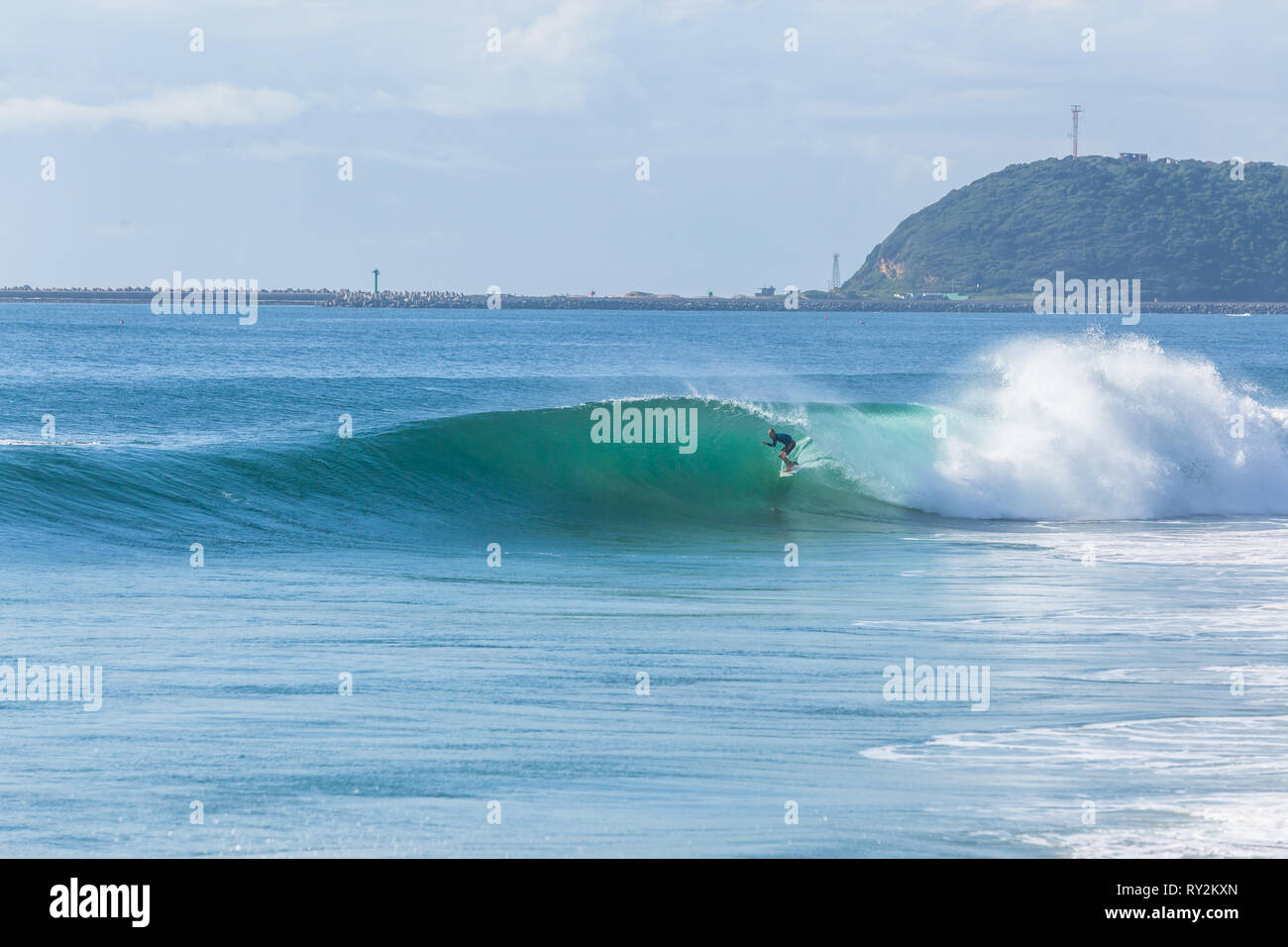 Surfer surfing tube ride turns hollow ocean wave a sporting lifestyle ...