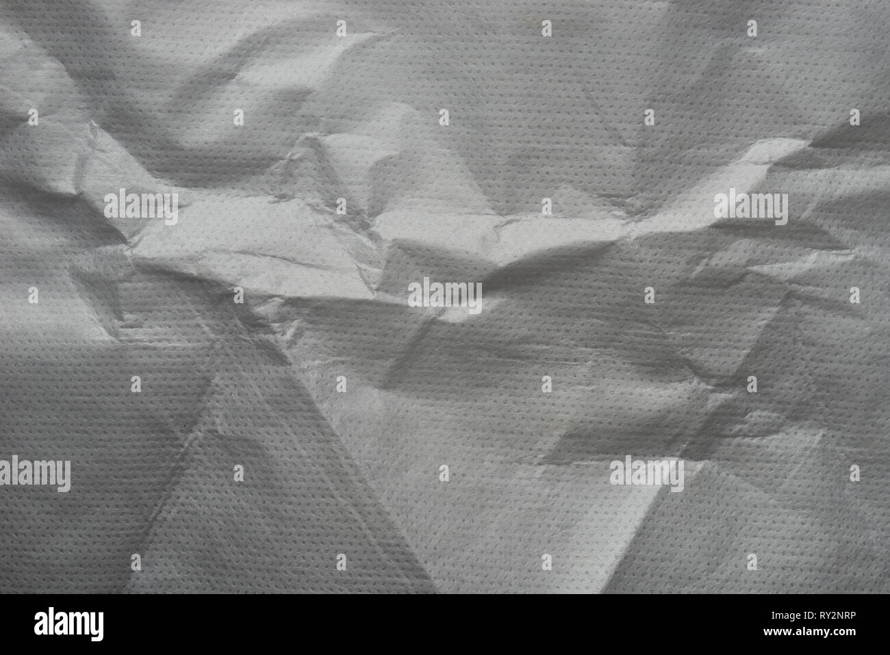 grey creased wrapping paper background texture closeup Stock Photo - Alamy