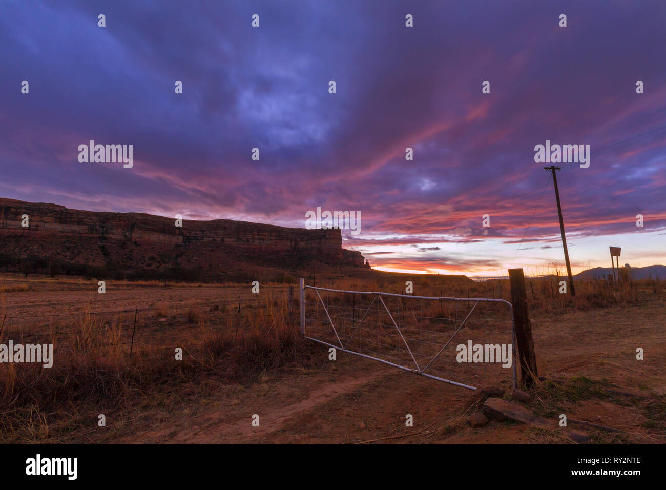 Farm gate after sunset Stock Photo - Alamy