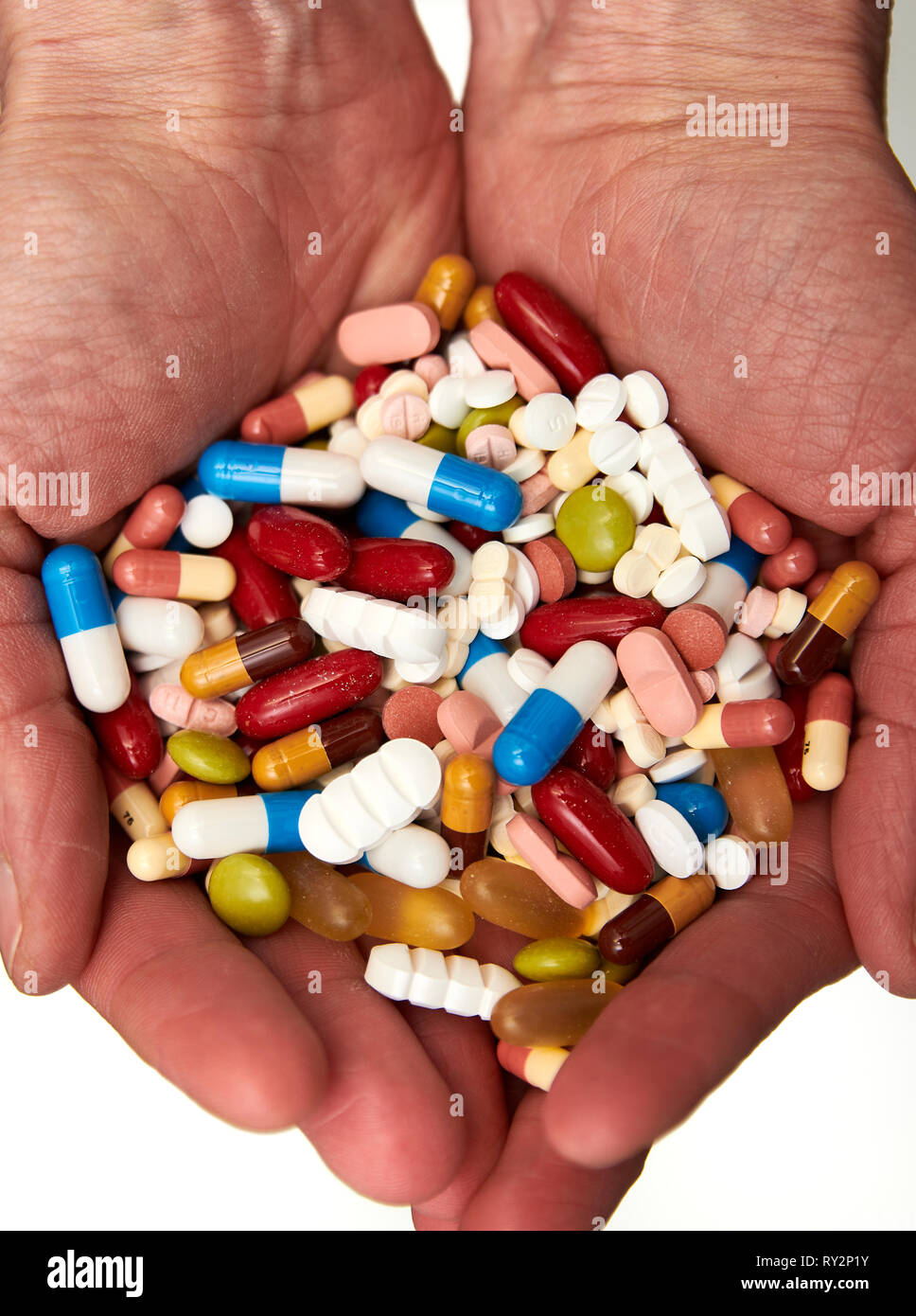 two hands full of tablets and pills Stock Photo - Alamy