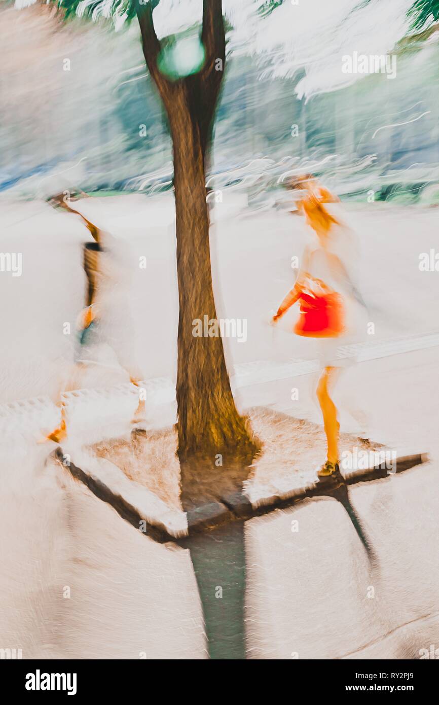 Two people walking in city, tree is dividing them - Abstract ...