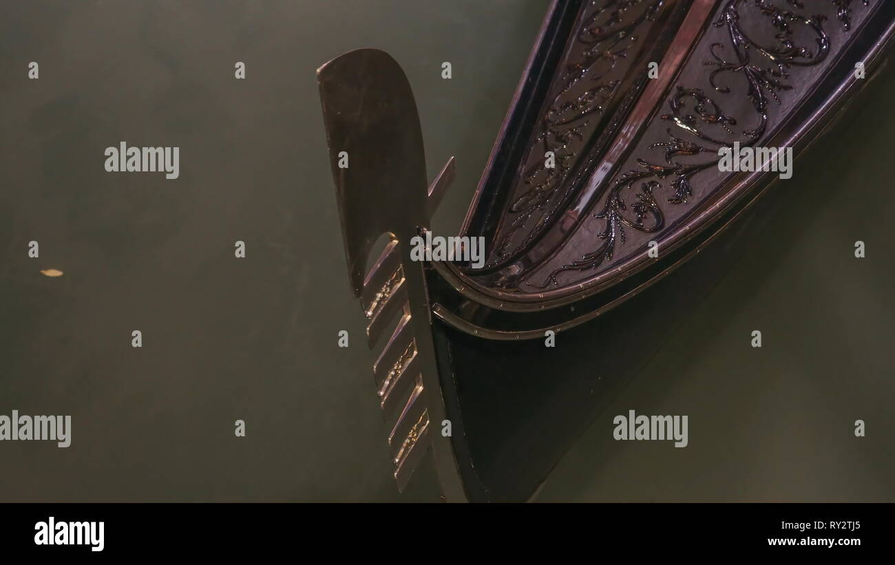 Flowery design on the black gondola while floating on the Venice canal ...