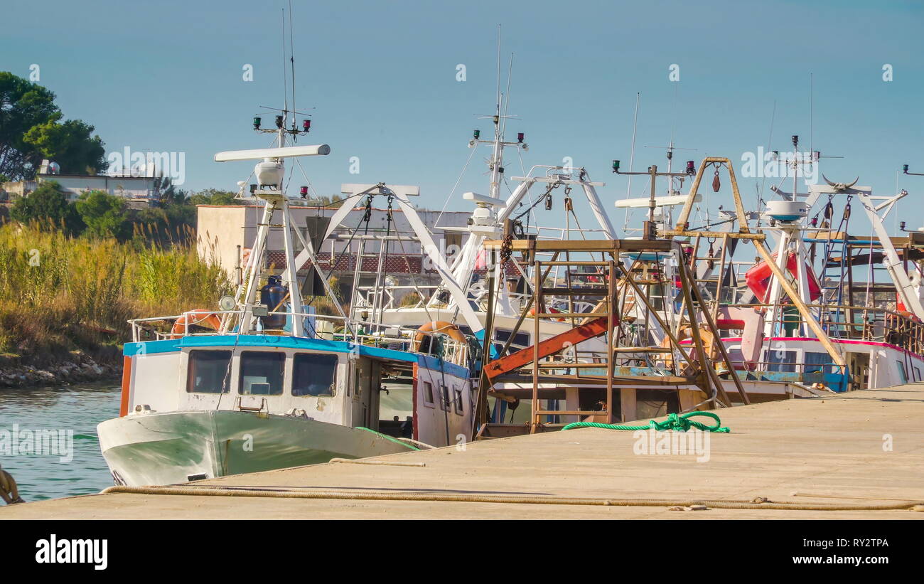 Lots of boats docking on the port in Capoiale park in Isola Varano ...