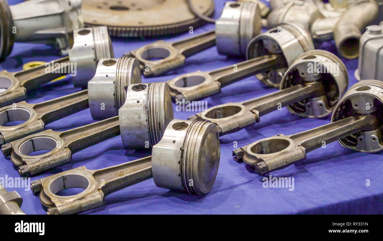 The metal pistons on the blue cloth table one of the parts of the cars ...