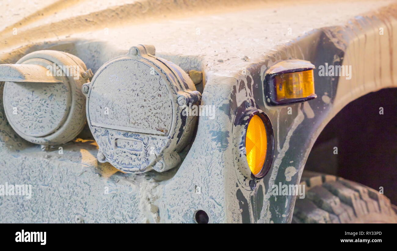 A dusty off road 4x4 car on the road dust and soil covering the ...