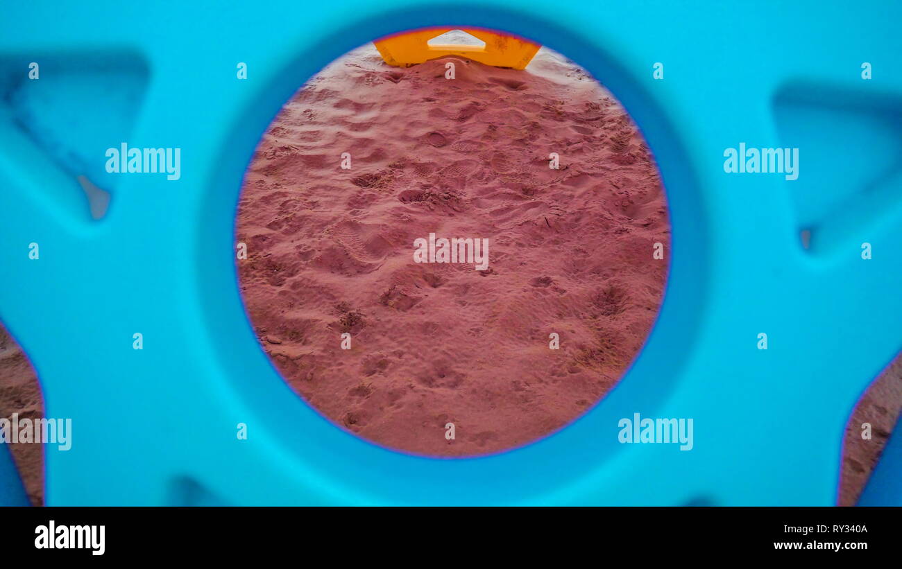 The blue star toy in the playground in the beach with the white sand of ...